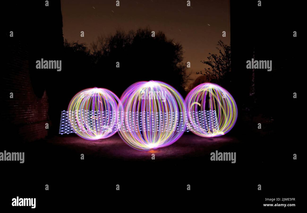 light painting at night with a slow shutter speed on the camera making ...