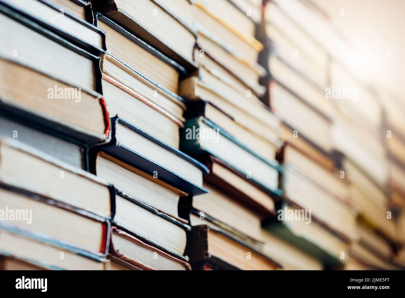 Background. Many old books and textbooks are in the library Stock Photo ...