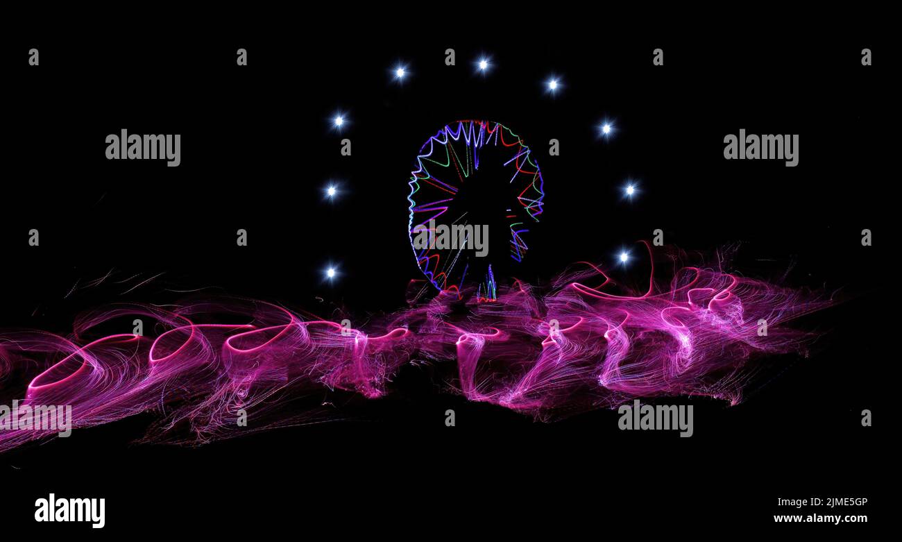 light painting at night with a slow shutter speed on the camera making ...