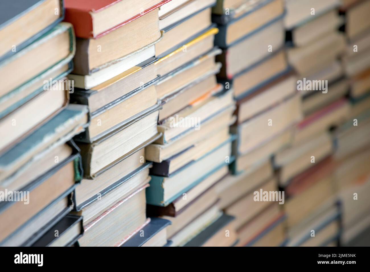 Background. Many old books and textbooks are in the library Stock Photo ...
