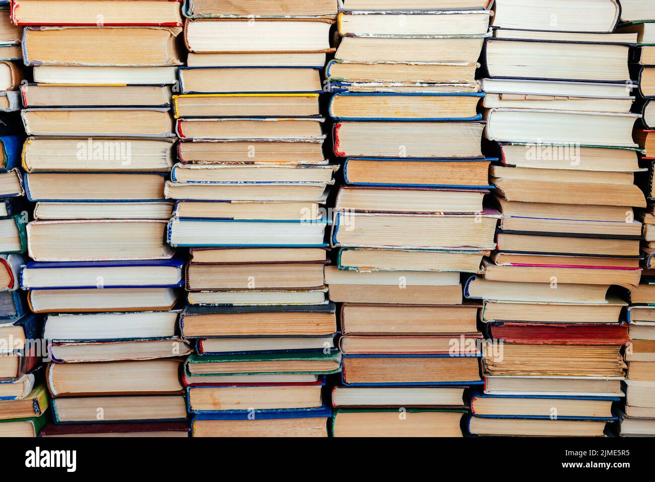 Background. Many old books and textbooks are in the library Stock Photo ...