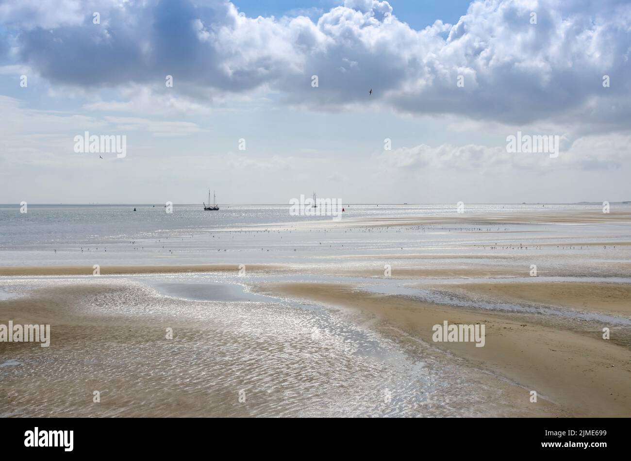 Wadden Sea with dry parts of the mudflats seen from the island of ...