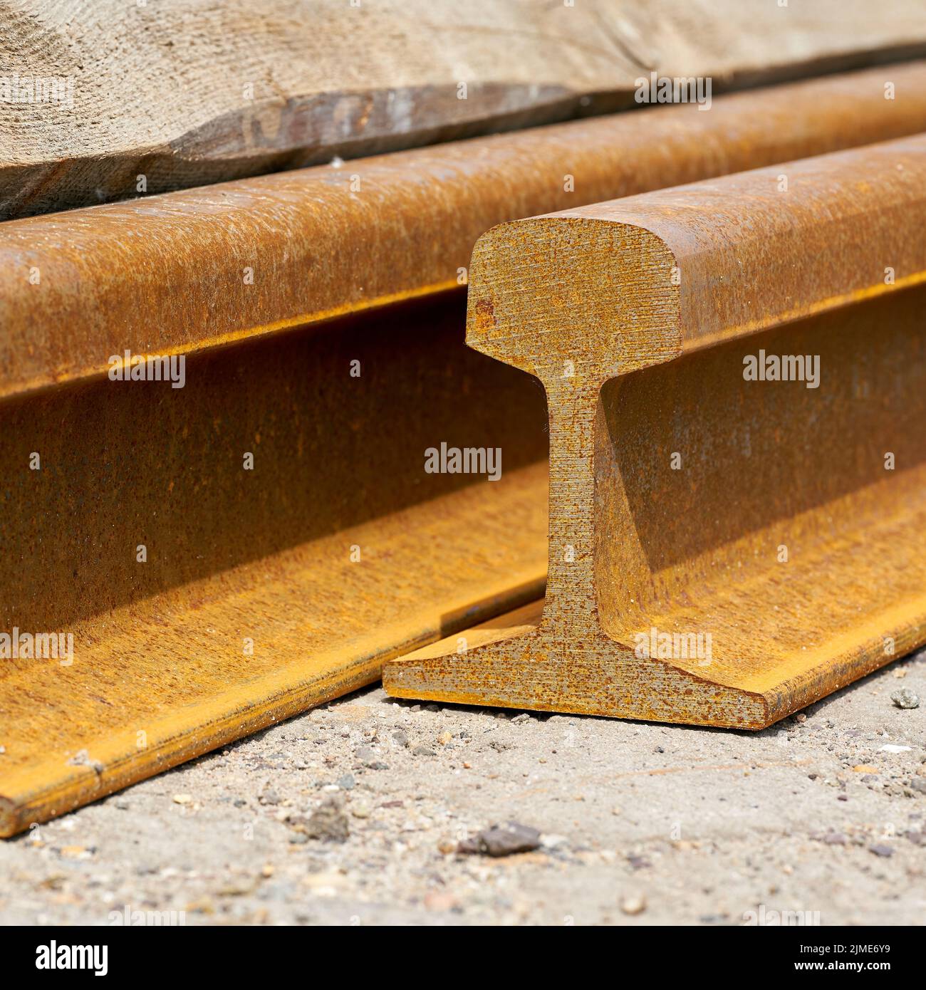 Close up of the cross section of a rusty railroad rail in a storage ...