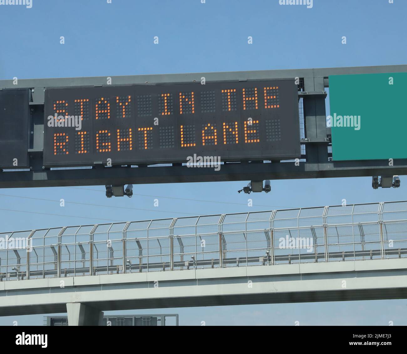 big highway sign to warn motorists to drive in the rightmost lane Stock ...