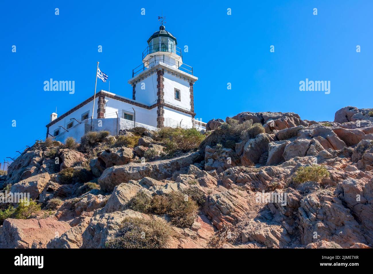 Greek Lighthouse on a Sunny Cliff Stock Photo - Alamy