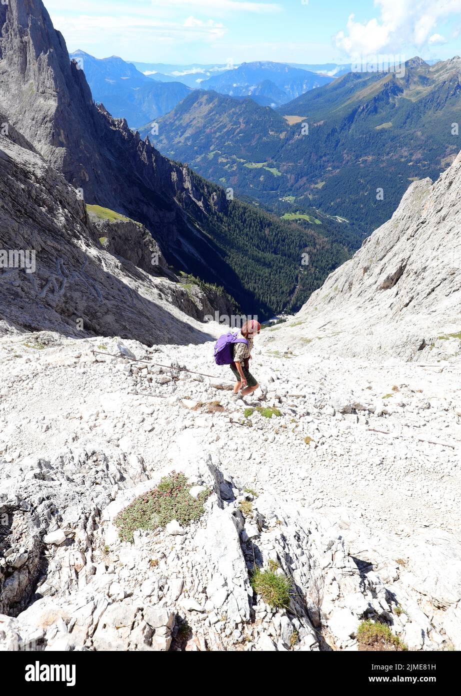 girl going down the mountain path to reach the South Tyrol valley in northern Italy Stock Photo ...