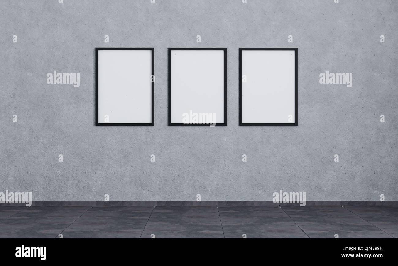 Three empty picture frames on grey concrete wall with dark tiling ...