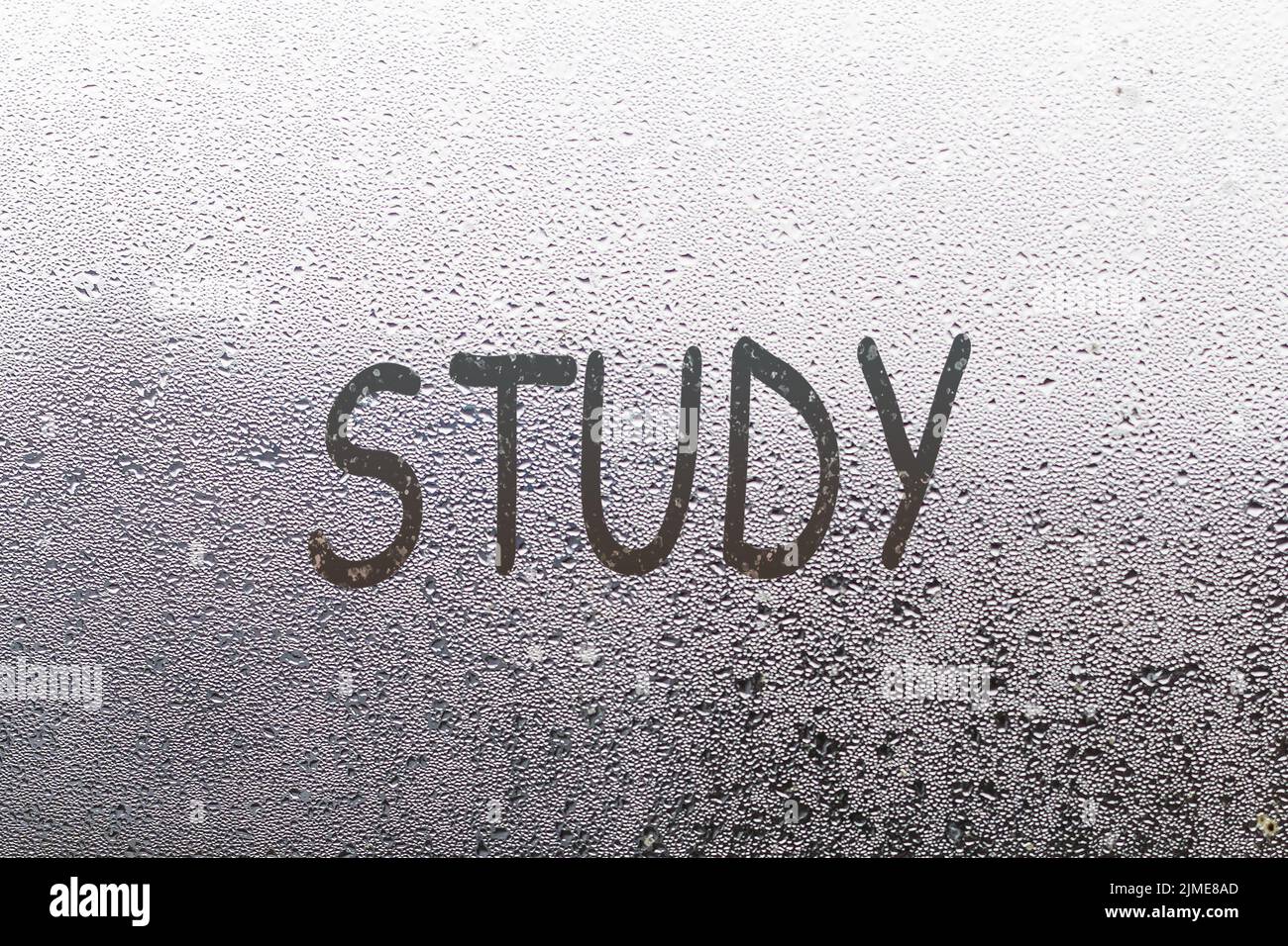 study word written on a window with raindrops Stock Photo - Alamy