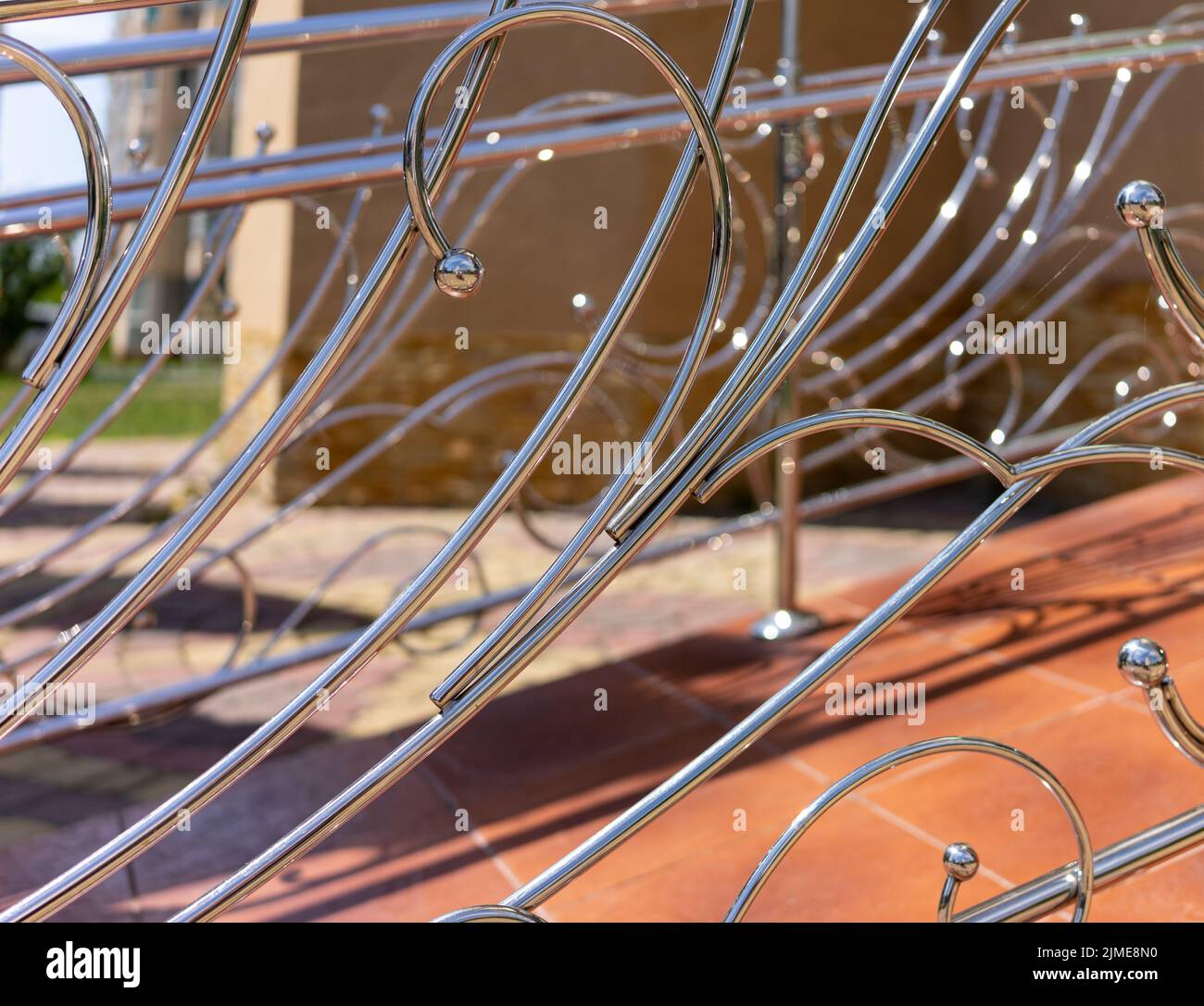 Decorative railing made of stainless metal close-up Stock Photo - Alamy