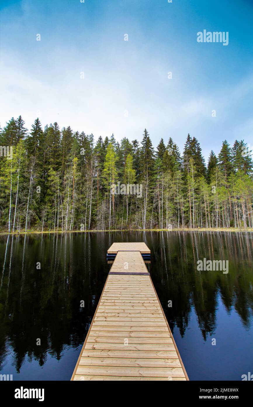 A beautiful landscape of a lake with calm waters that reflect the ...
