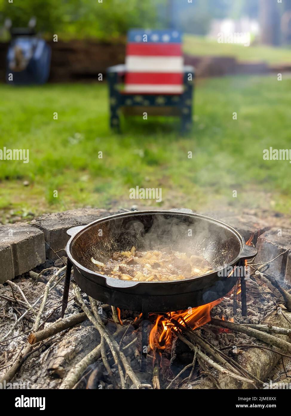 Gourmet beef stew cooked in cauldron on outdoor fire pit Stock Photo ...
