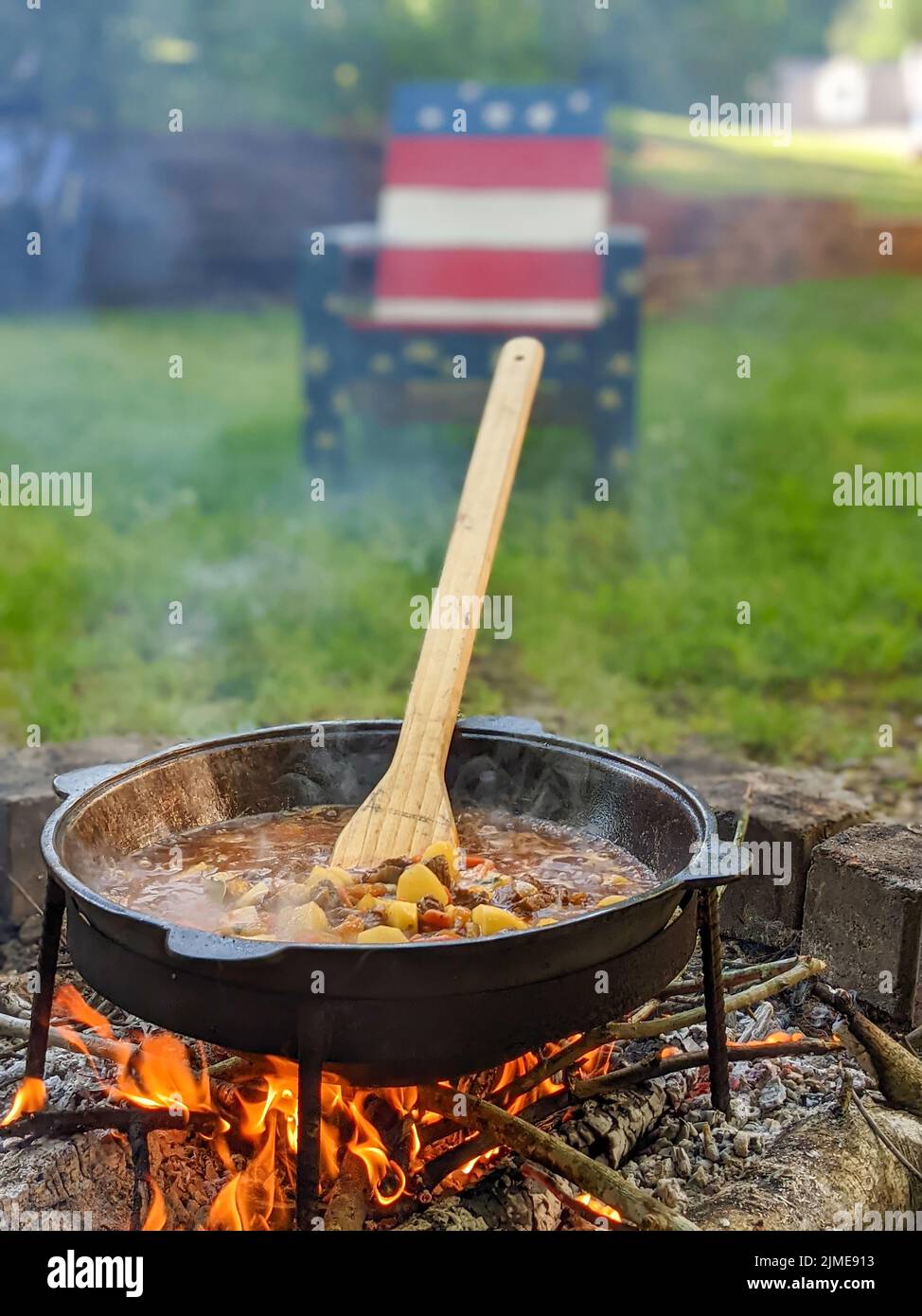 Gourmet beef stew cooked in cauldron on outdoor fire pit Stock Photo ...