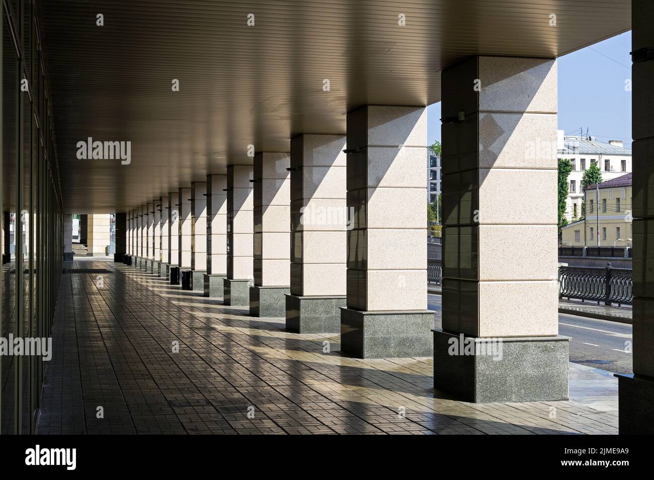 Long passage with columns Stock Photo - Alamy
