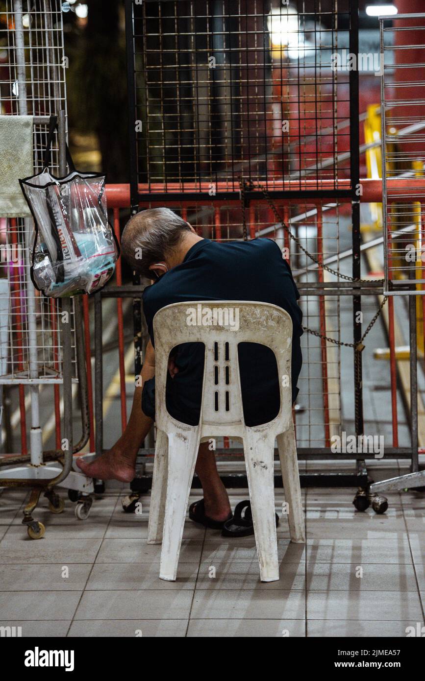 Sleeping man chair from behind hi-res stock photography and images - Alamy