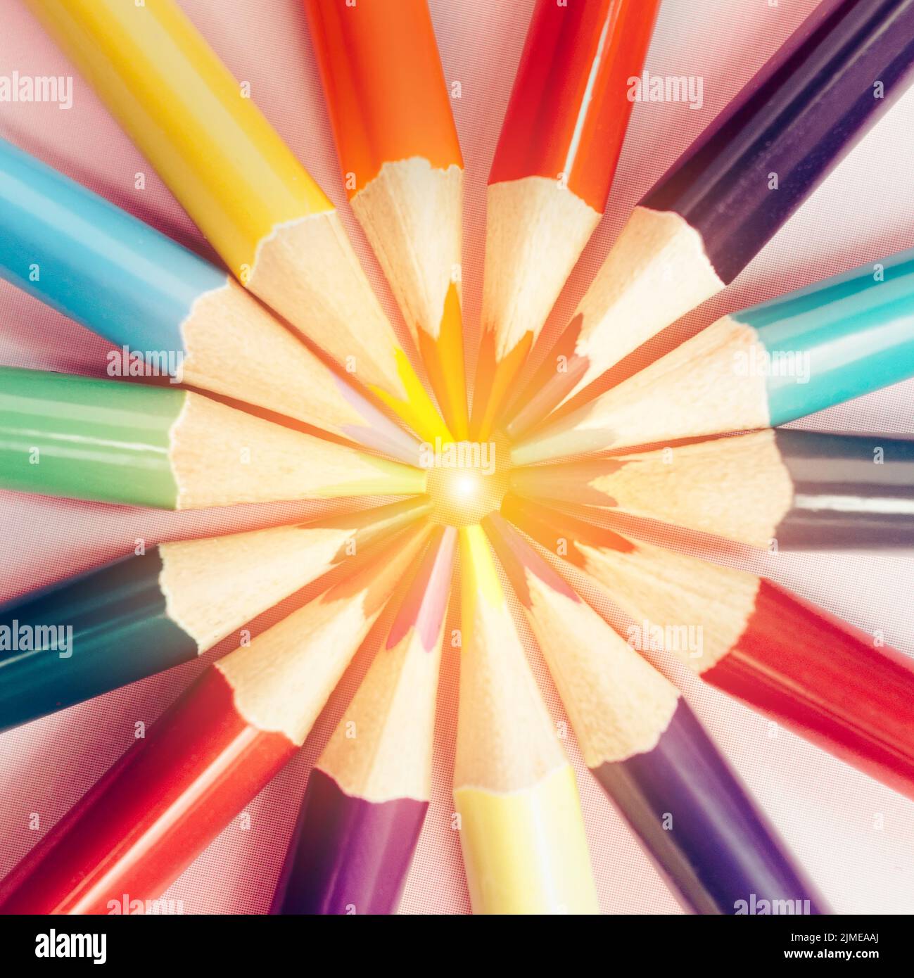A figure of colored pencils in the shape of the sun with rays. The ...