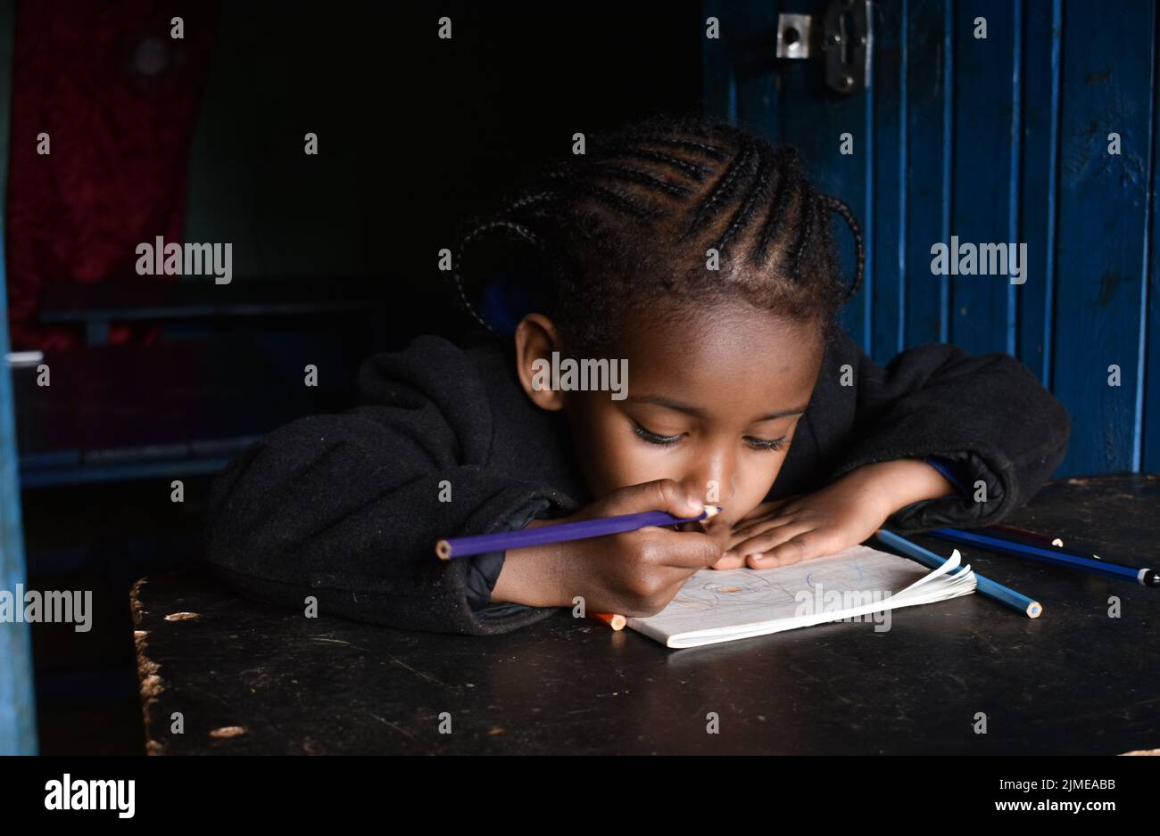 Poor child studying at home hi-res stock photography and images - Alamy