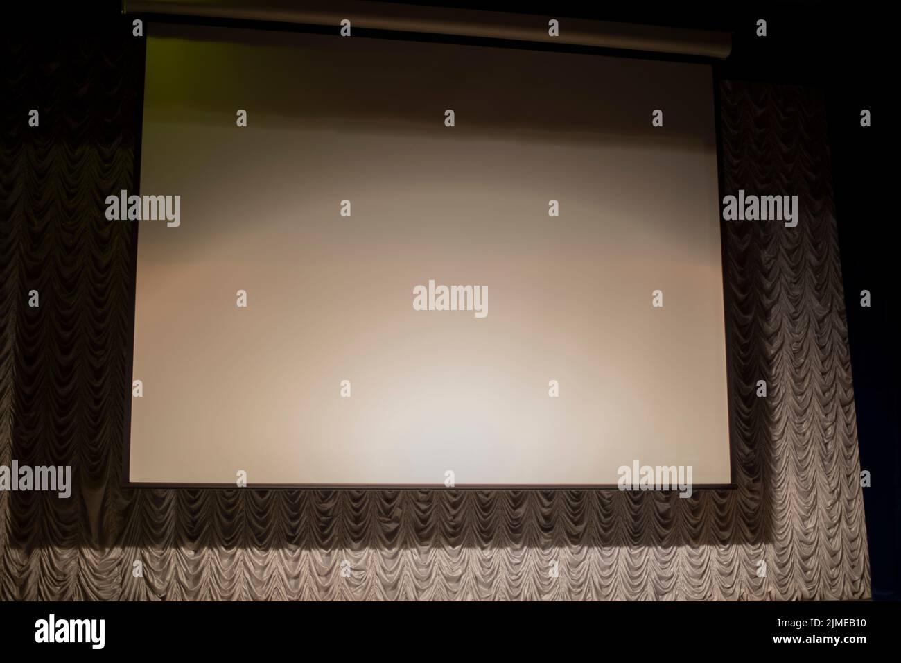 Screen for projector. Auditorium. White screen for image projection ...