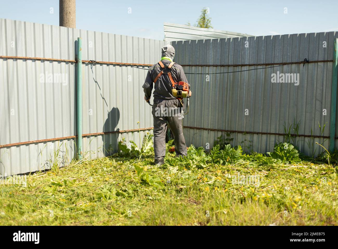 Cutting long grass by hand hi-res stock photography and images - Alamy
