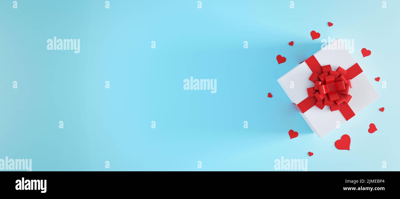 White gift box with red ribbon bow on light blue background with heart ...