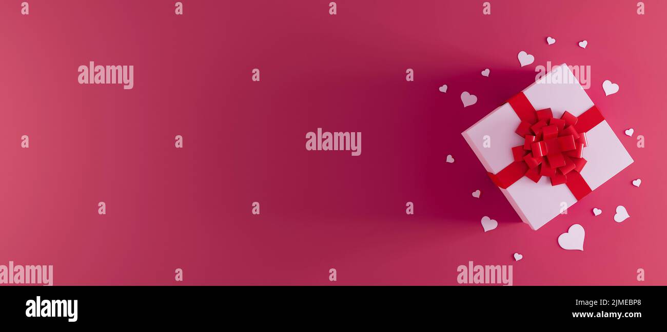 White gift box with red ribbon bow on pink background with heart ...