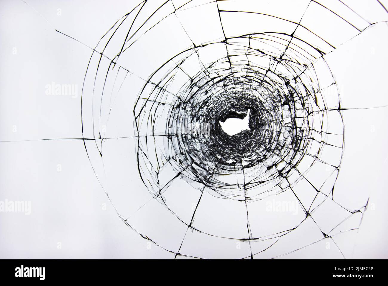 Broken transparent glass on the door window, a hole in the damaged ...