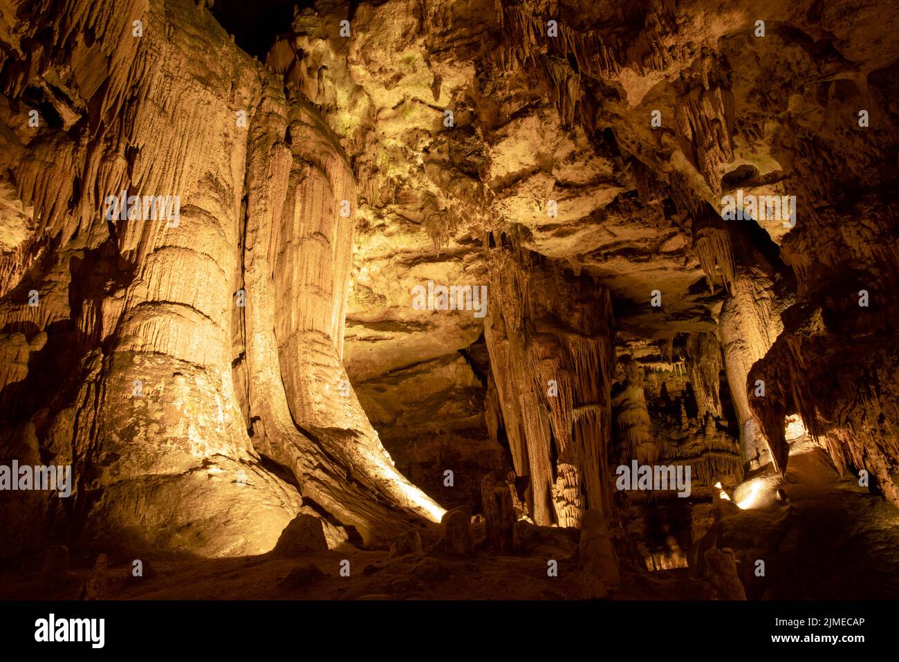 Enormous pillars and rock formations inside underground cave cavern ...