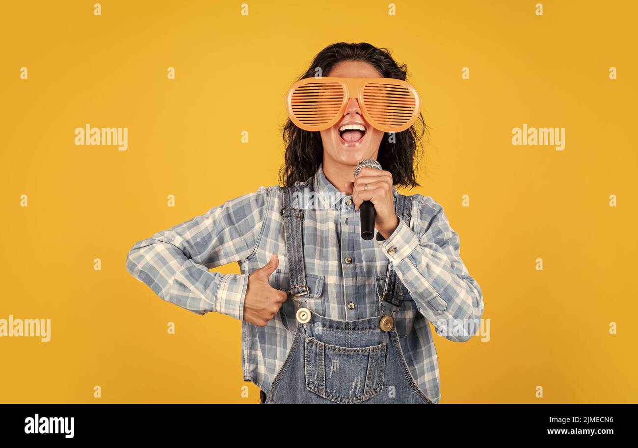 feel a success. Have Fun on Celebration. woman singing with microphone ...