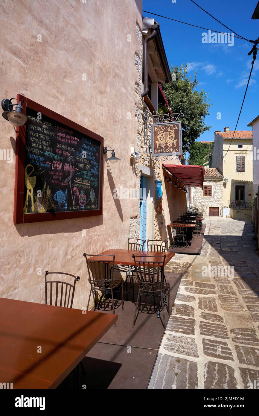 Konoba in the old town of Krk in Croatia. A konoba is a restaurant ...