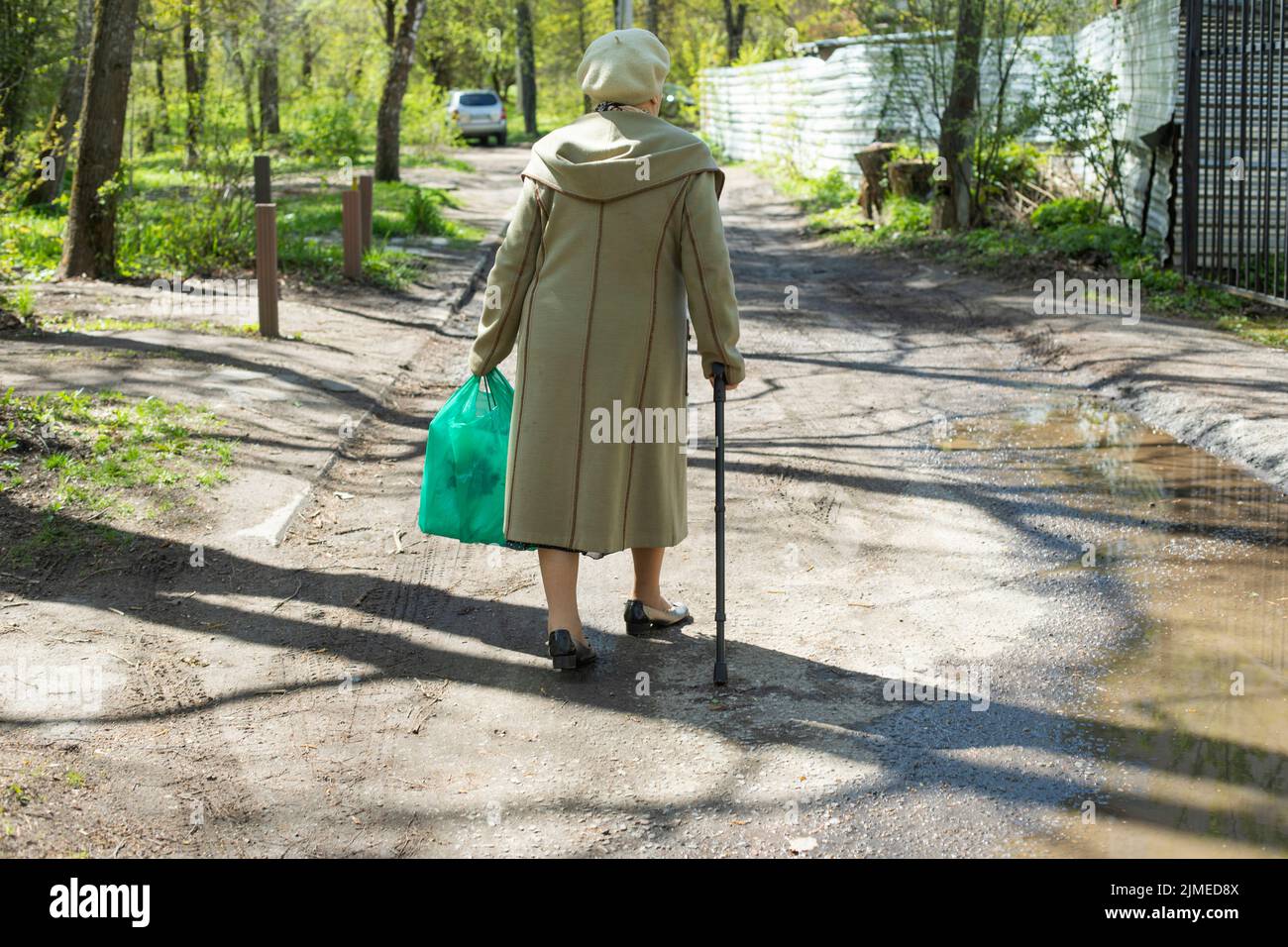Pensioner Walks Down Street Grandmother In Russia Woman With Walking