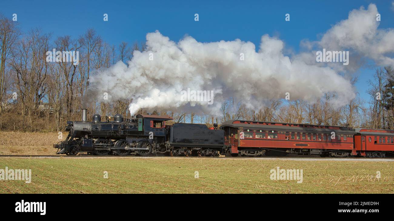Antique Restored Steam Passenger Train Blowing Smoke and Steam Stock ...