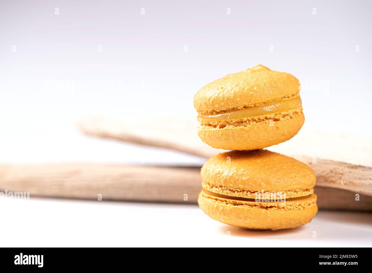 macarons, confectionery sweet product, yellow macarons isolated on ...