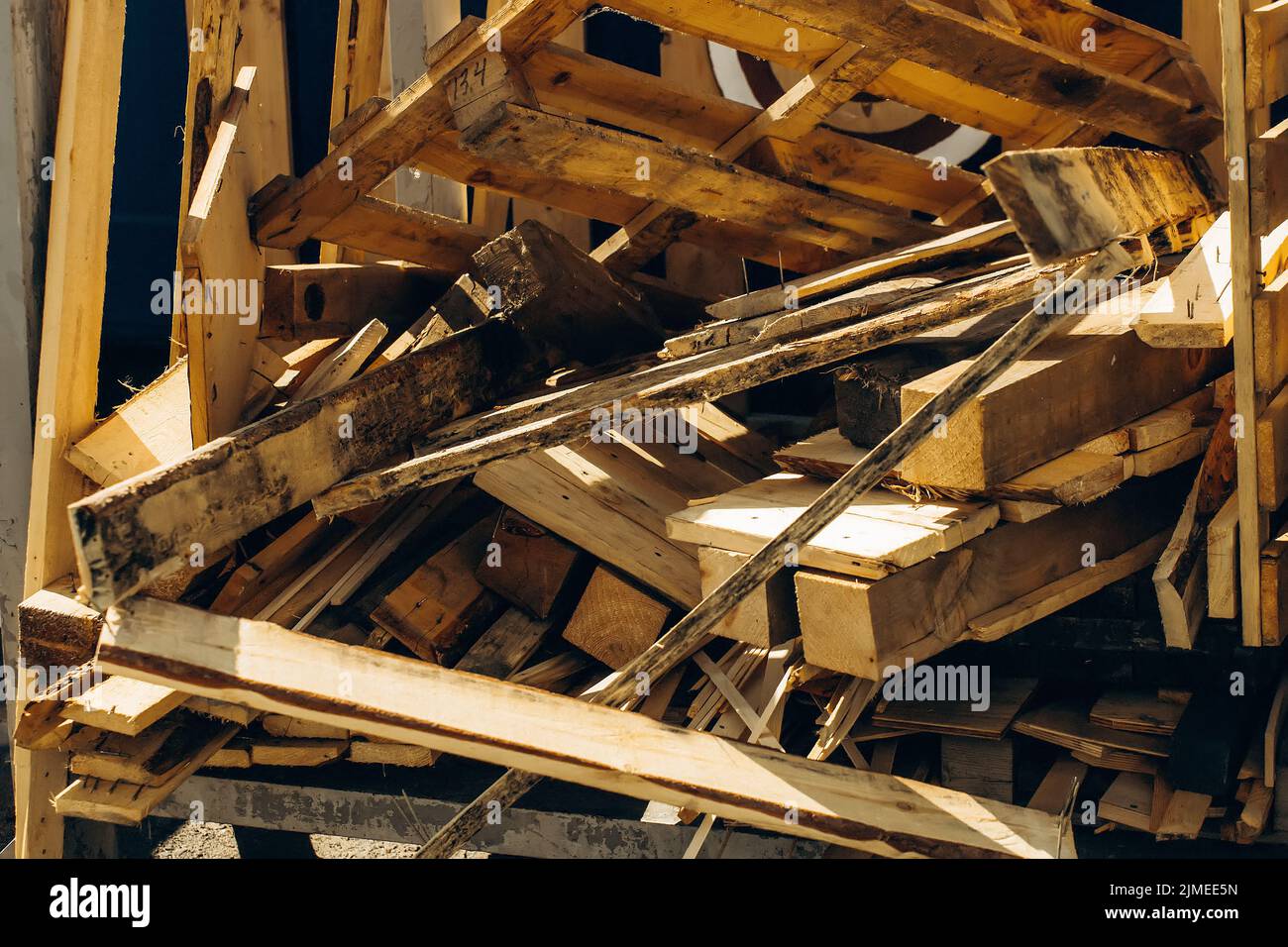Wooden waste from boards and bars. Wood processing Stock Photo - Alamy