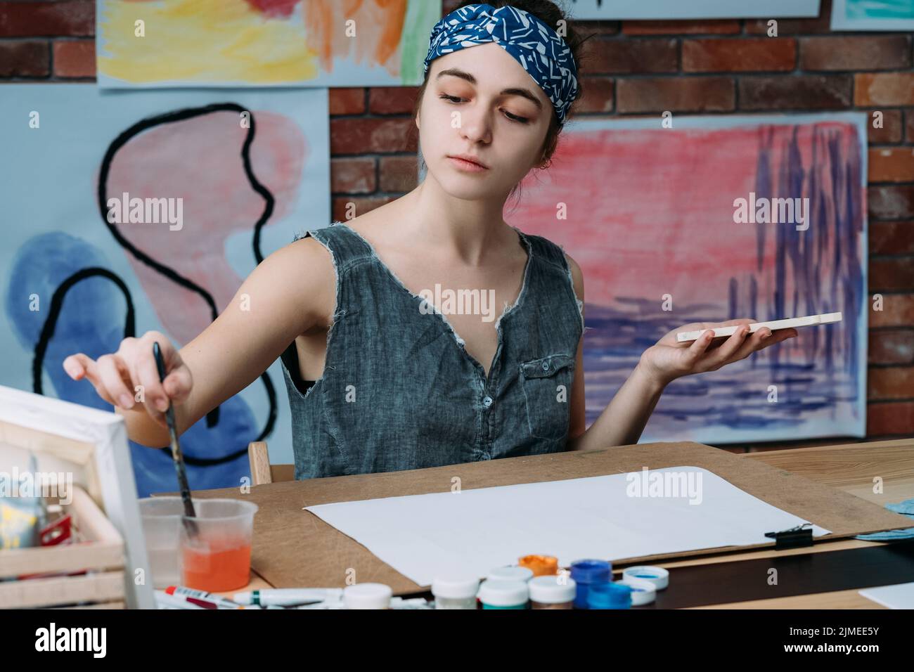 contemporary artwork artist lady painting workshop Stock Photo - Alamy