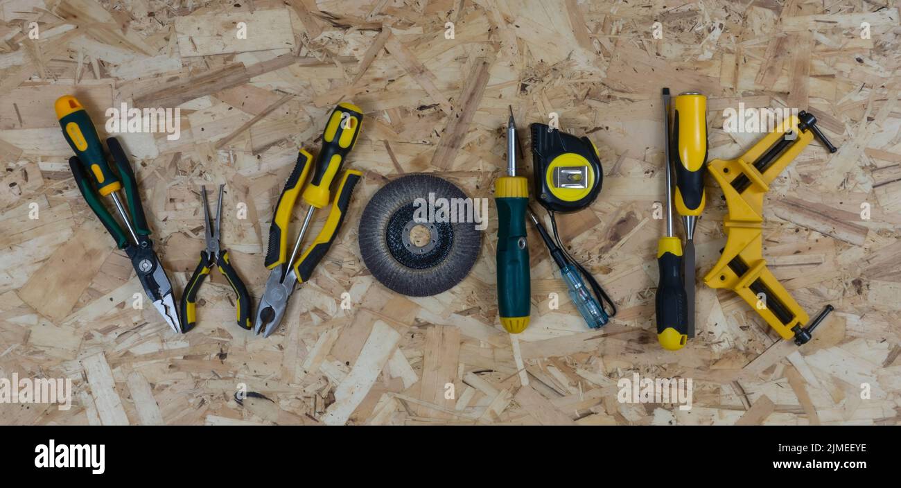 The word WORK made up of letters collected from construction tools ...