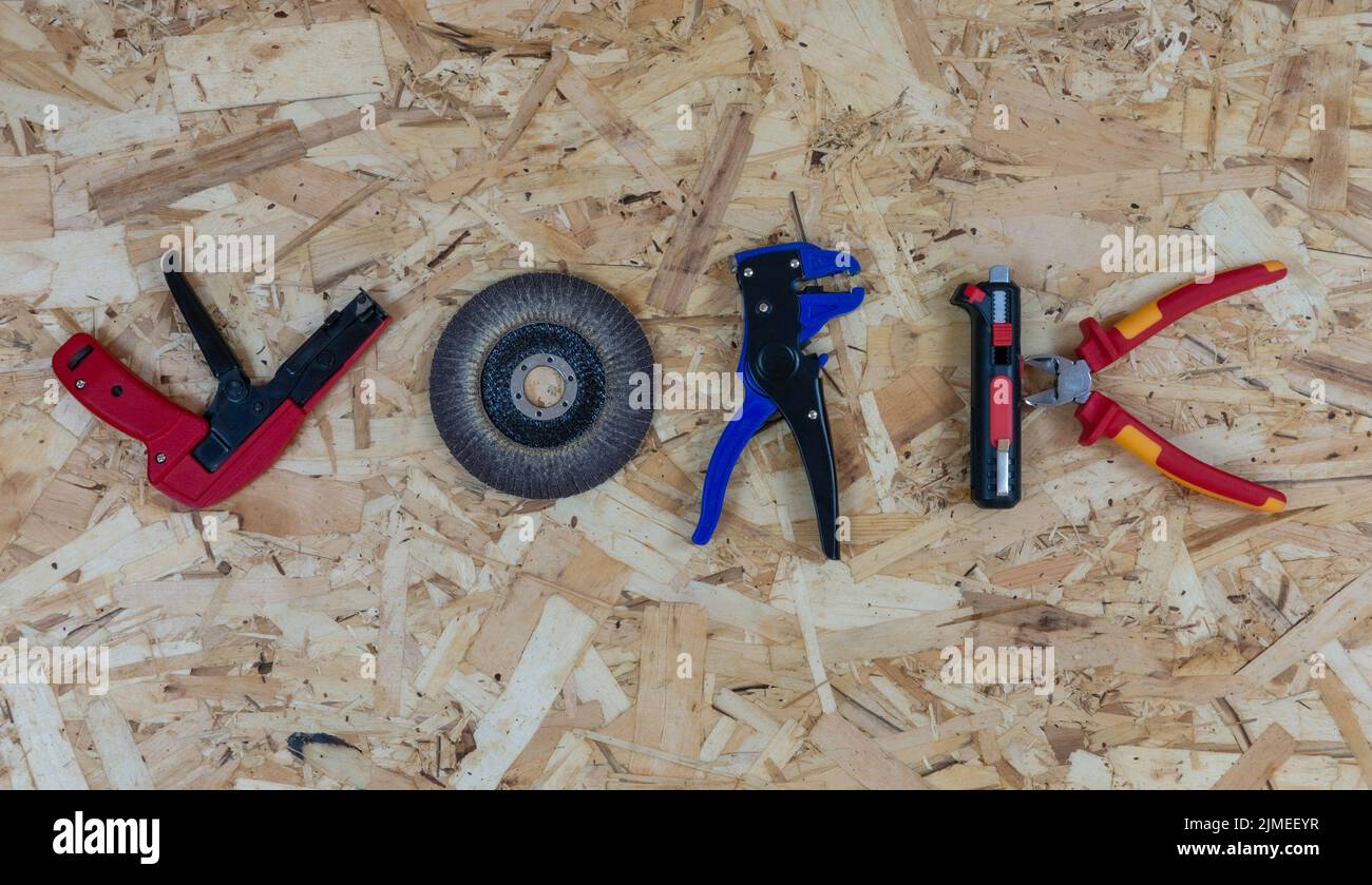 The word WORK made up of letters collected from electrician tools ...