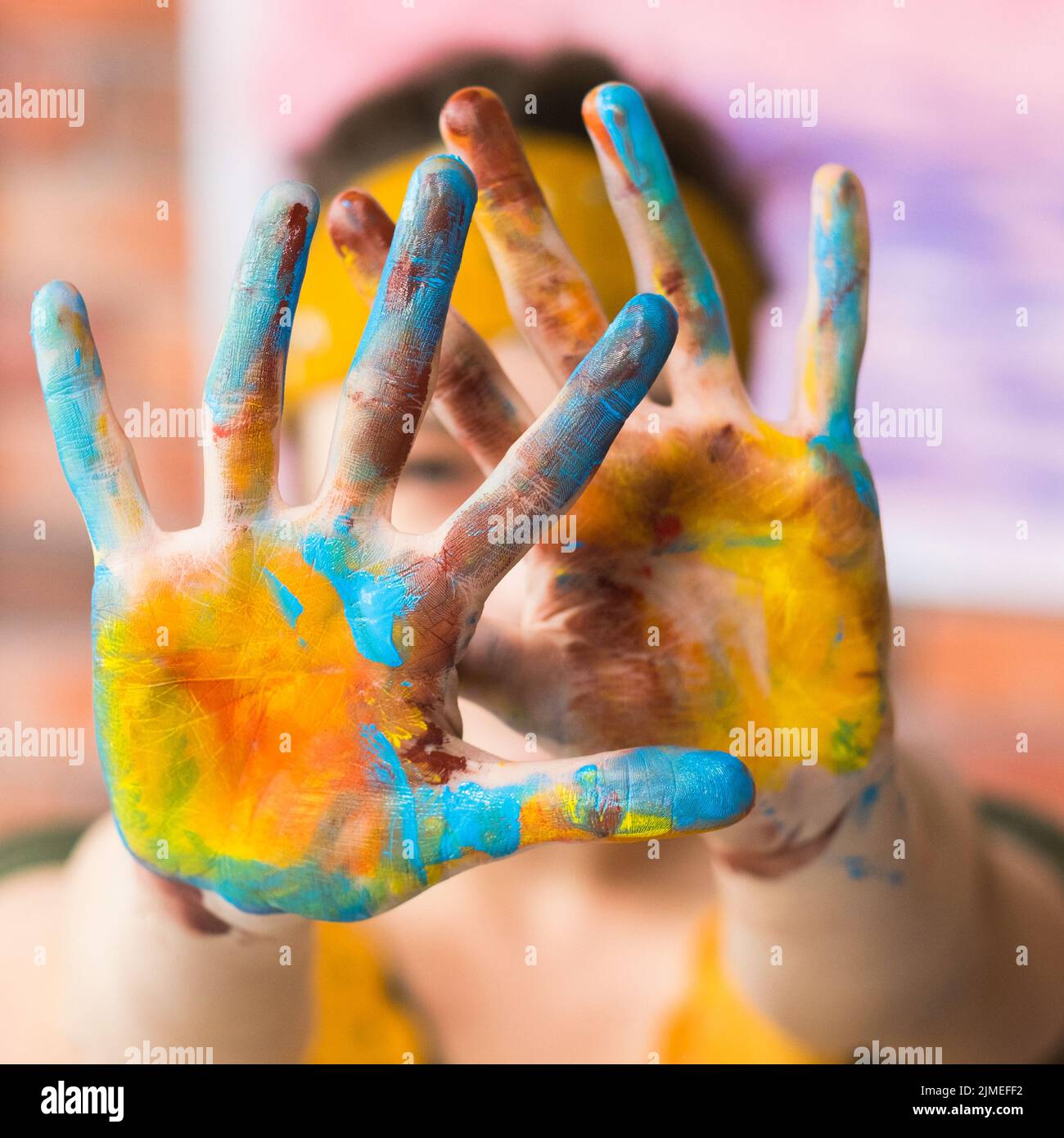 contemporary art performance hands colorful paint Stock Photo - Alamy