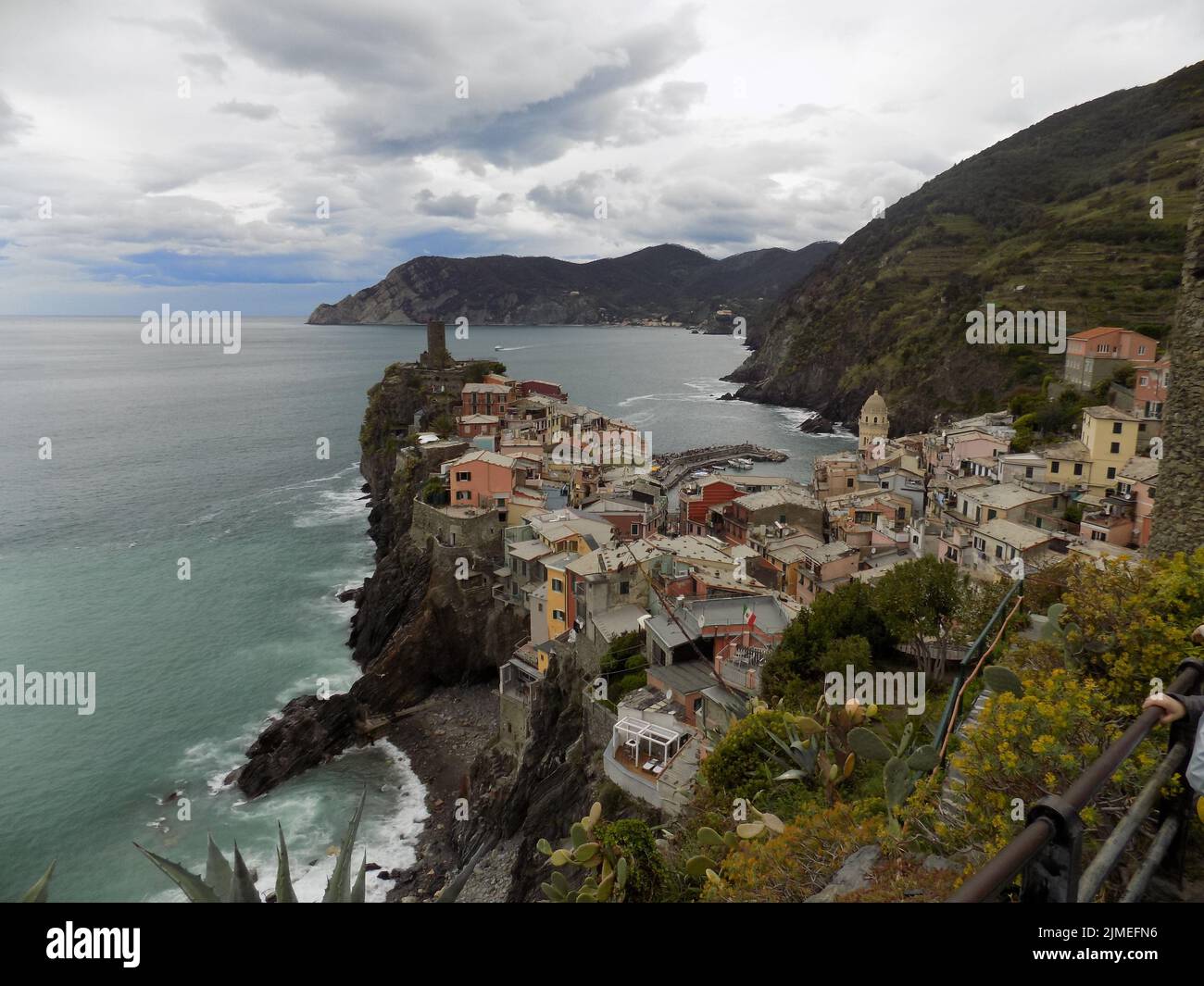 The top view of Cinque Terre villages by the sea on a cloudy day in ...