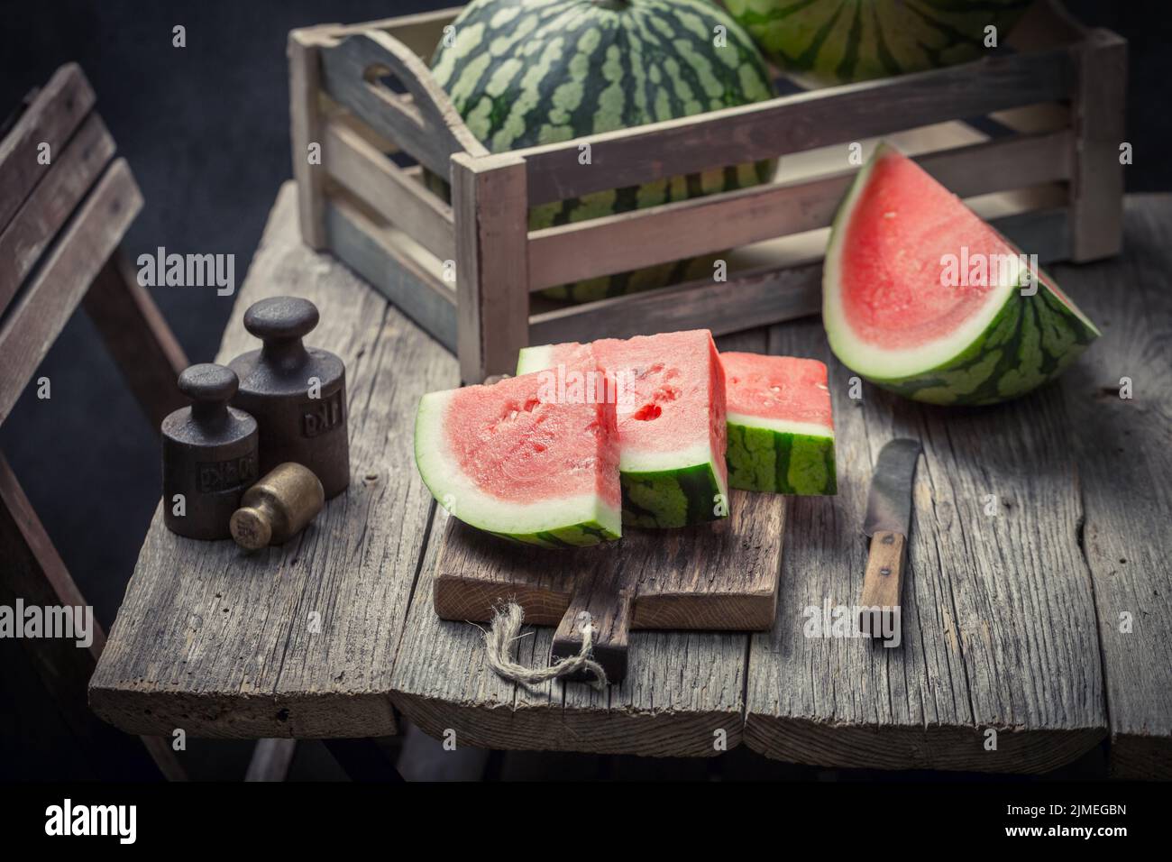 Tasty and bio chopped watermelon on old wooden table. Watermelon sliced ...