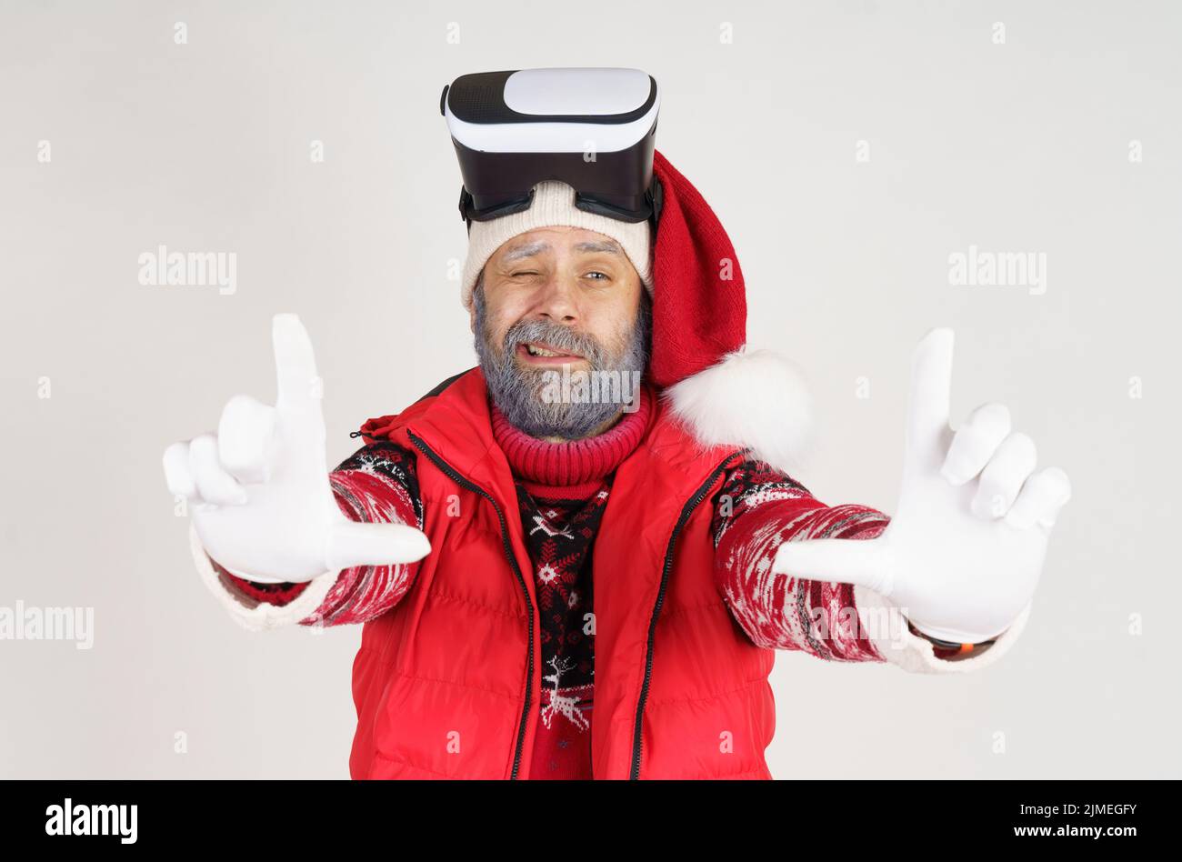 Holiday and Christmas concept. Santa Claus put on virtual glasses and ...