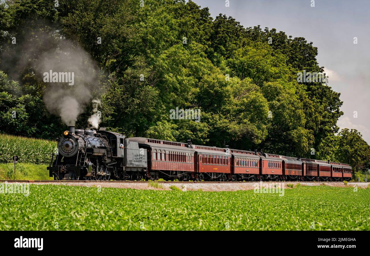 View of an Antique Restored Steam Passenger Train Blowing Smoke Stock ...