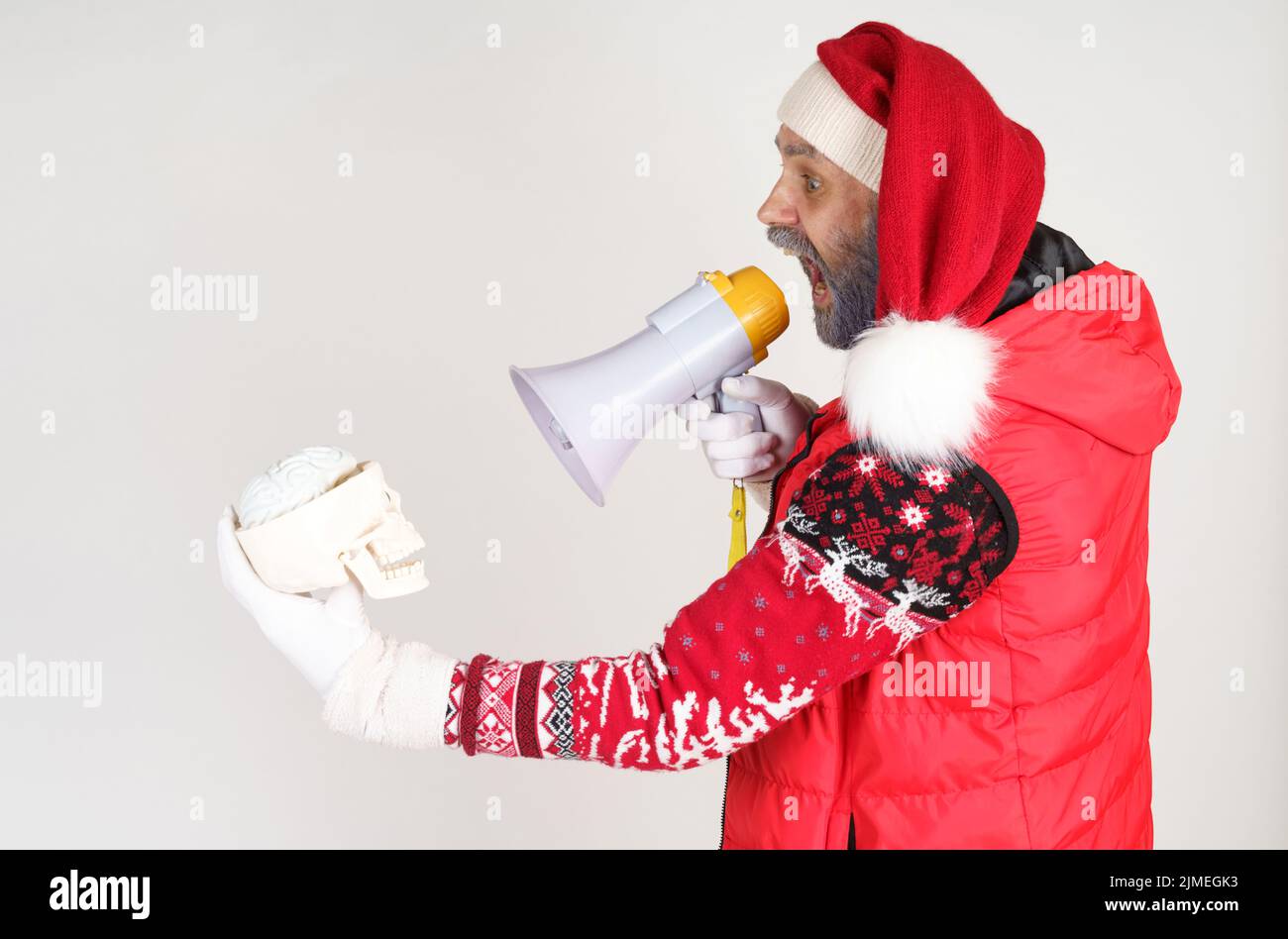 New Year and Christmas concept. Santa Claus speaks into a loudspeaker ...