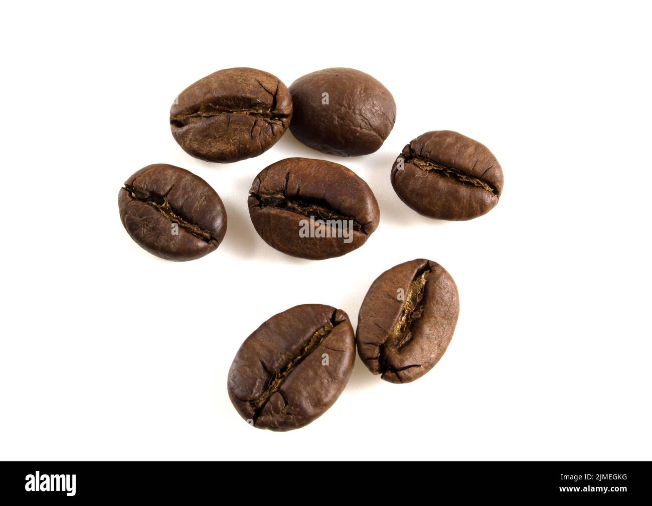Several roasted arabica beans isolated on white background Stock Photo ...