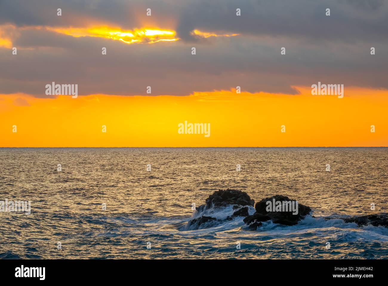 Amazing Sea Sunset Colours and Coastal Rocks Stock Photo - Alamy