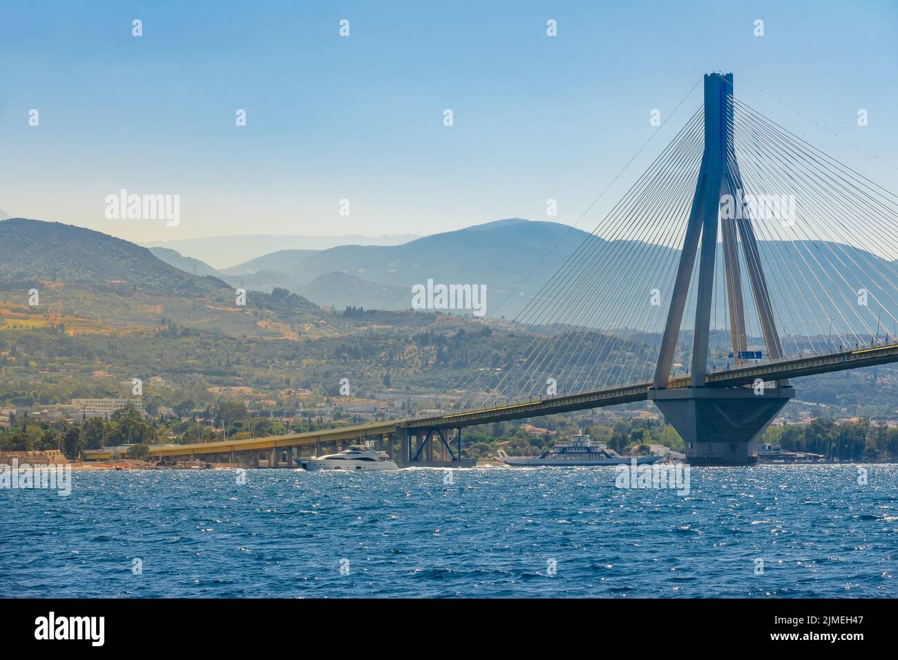 Motor Yacht and Ferry at Greek Bridge Over Gulf of Corinth Stock Photo ...