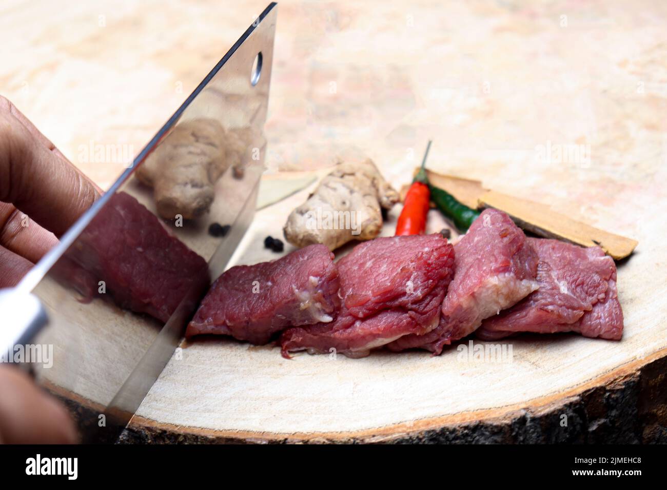 tasty cow beef with spice on chopping board Stock Photo - Alamy