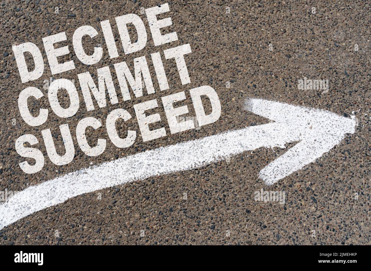 Business concept. On the asphalt road markings an arrow with the ...