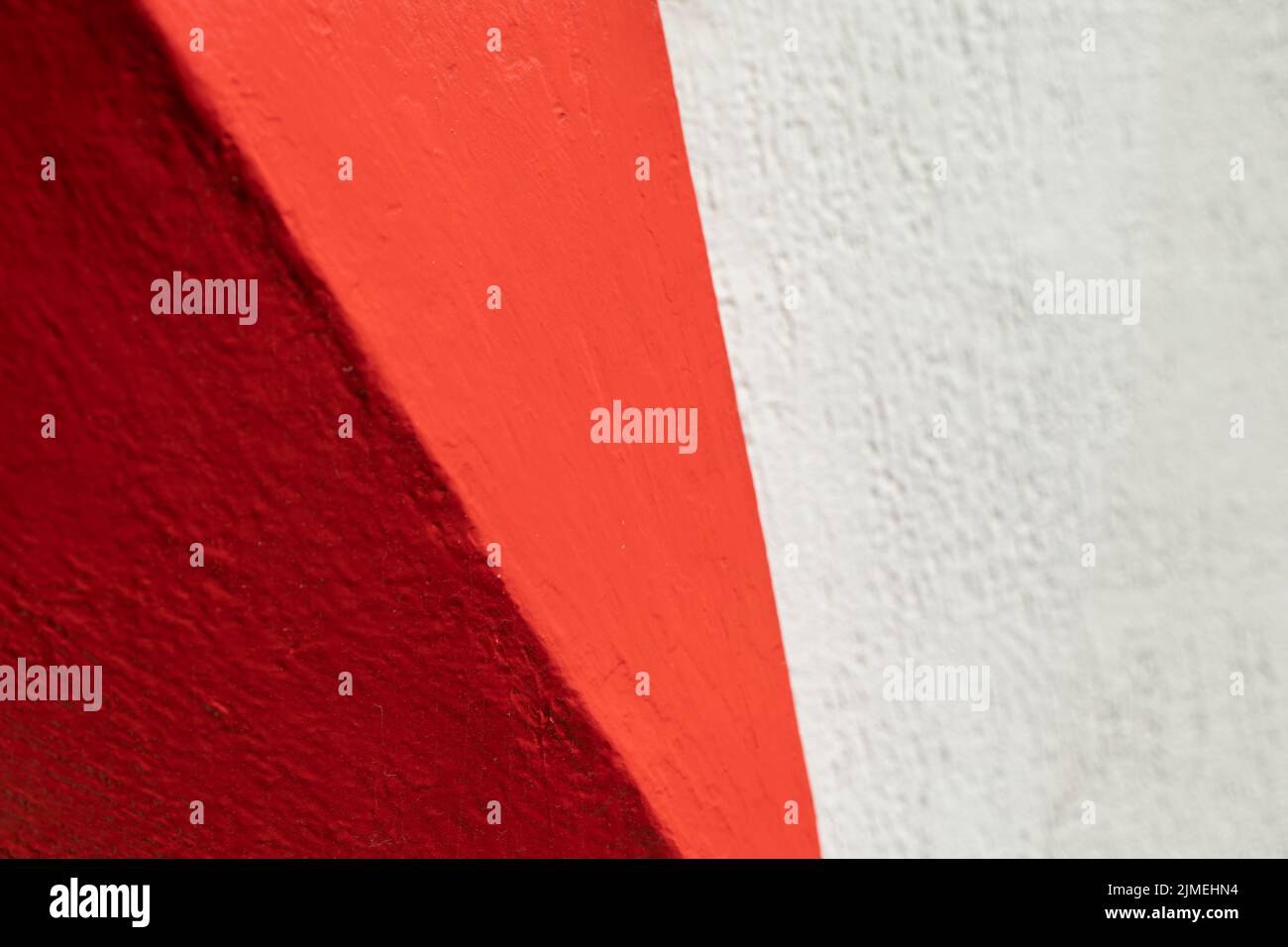 The abstract background is red and white. Detail of the architecture of ...