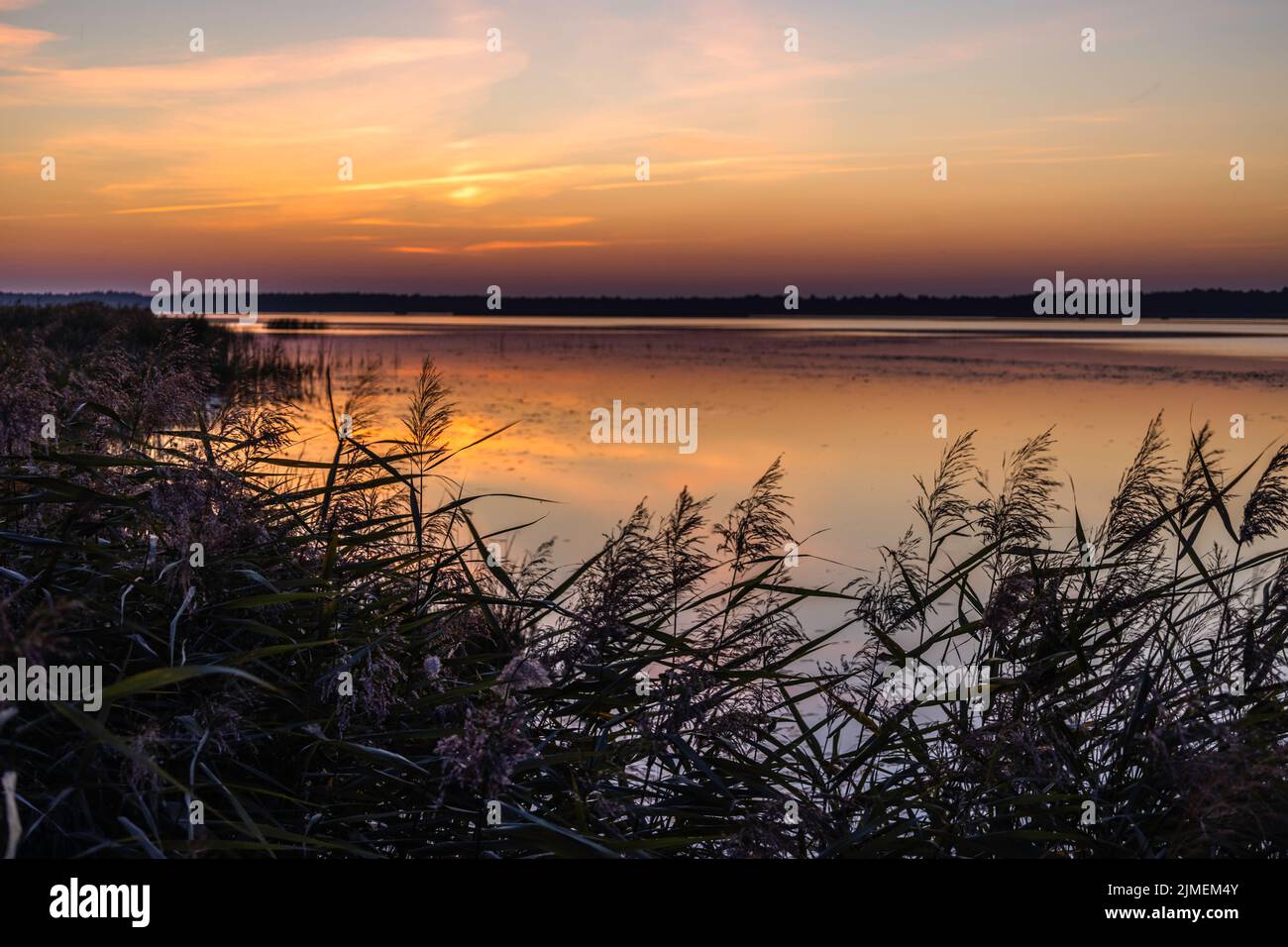 Romantic Sunset Glowing Twilight Over the Lake Stock Photo - Alamy