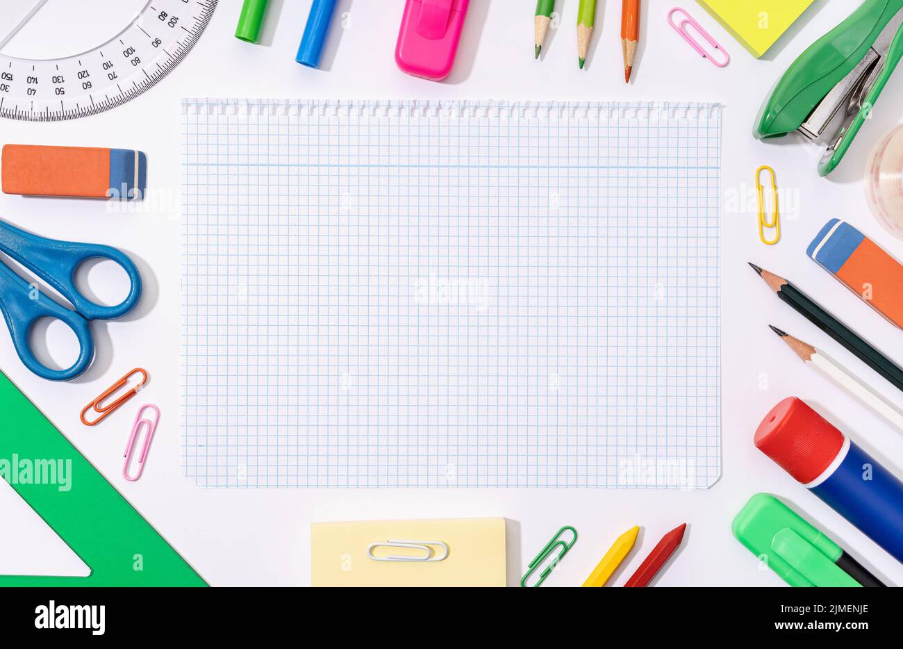 Blank graph paper sheet and School and office supplies around. Back to ...
