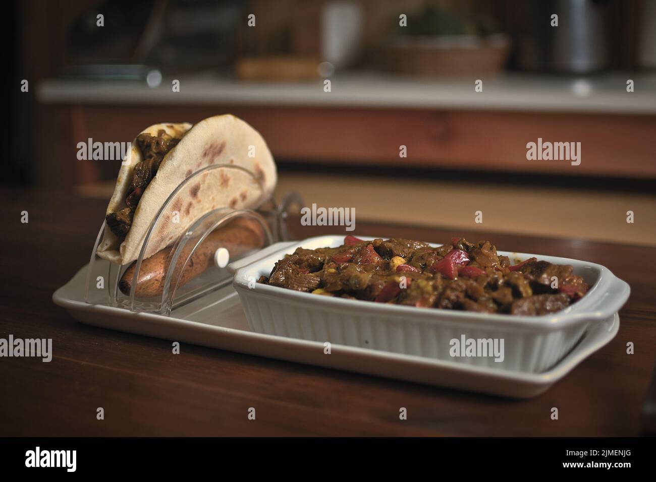 Rustic flat taco tortillas with traditional meat filling. Presented ...